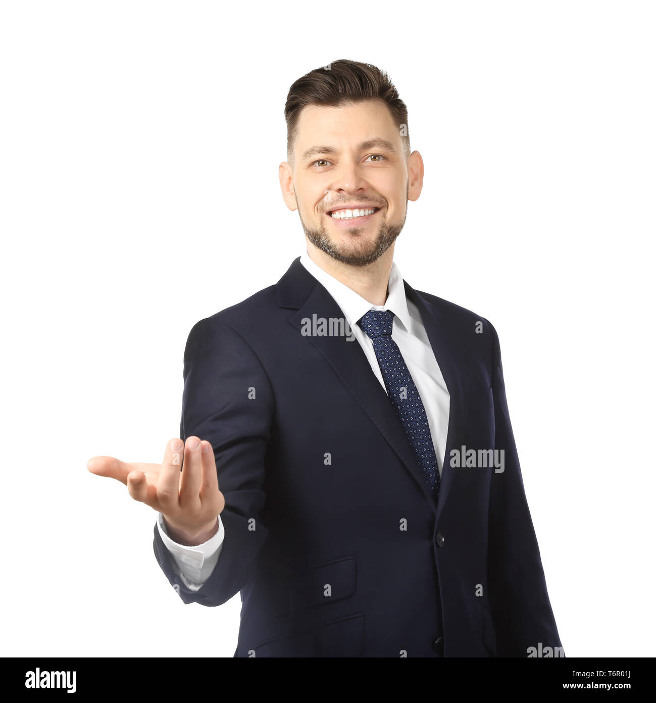 Young businessman holding something on white background Stock Photo - Alamy