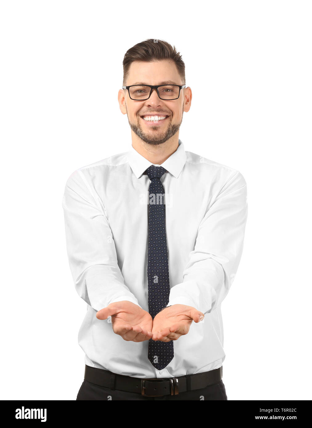 Young businessman holding something on white background Stock Photo - Alamy