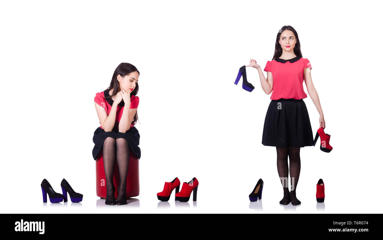 Young woman with choice of shoes on white Stock Photo - Alamy