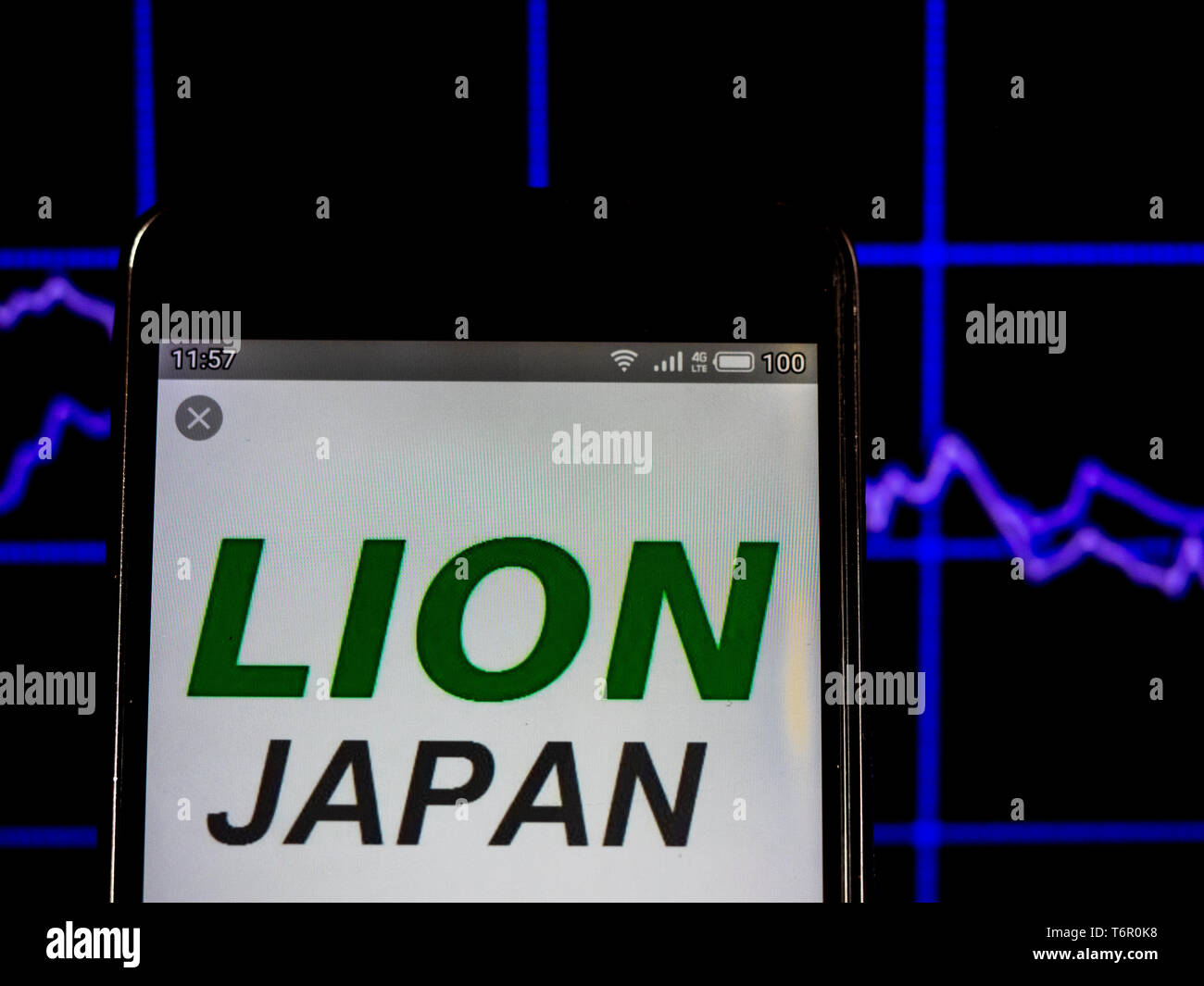 In this photo illustration a Lion Corporation logo seen displayed on a ...