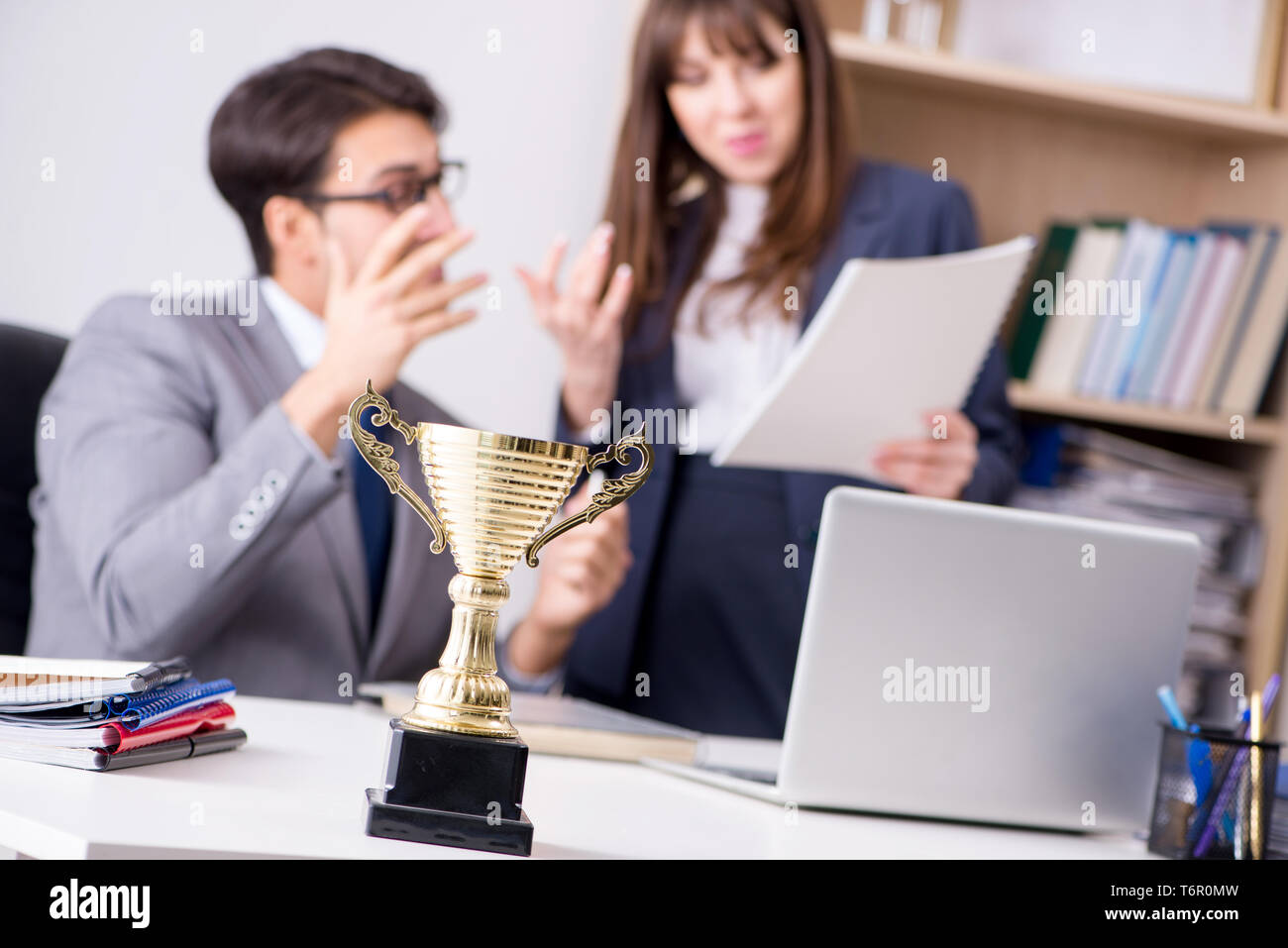Concept of teamwork with prize Stock Photo - Alamy