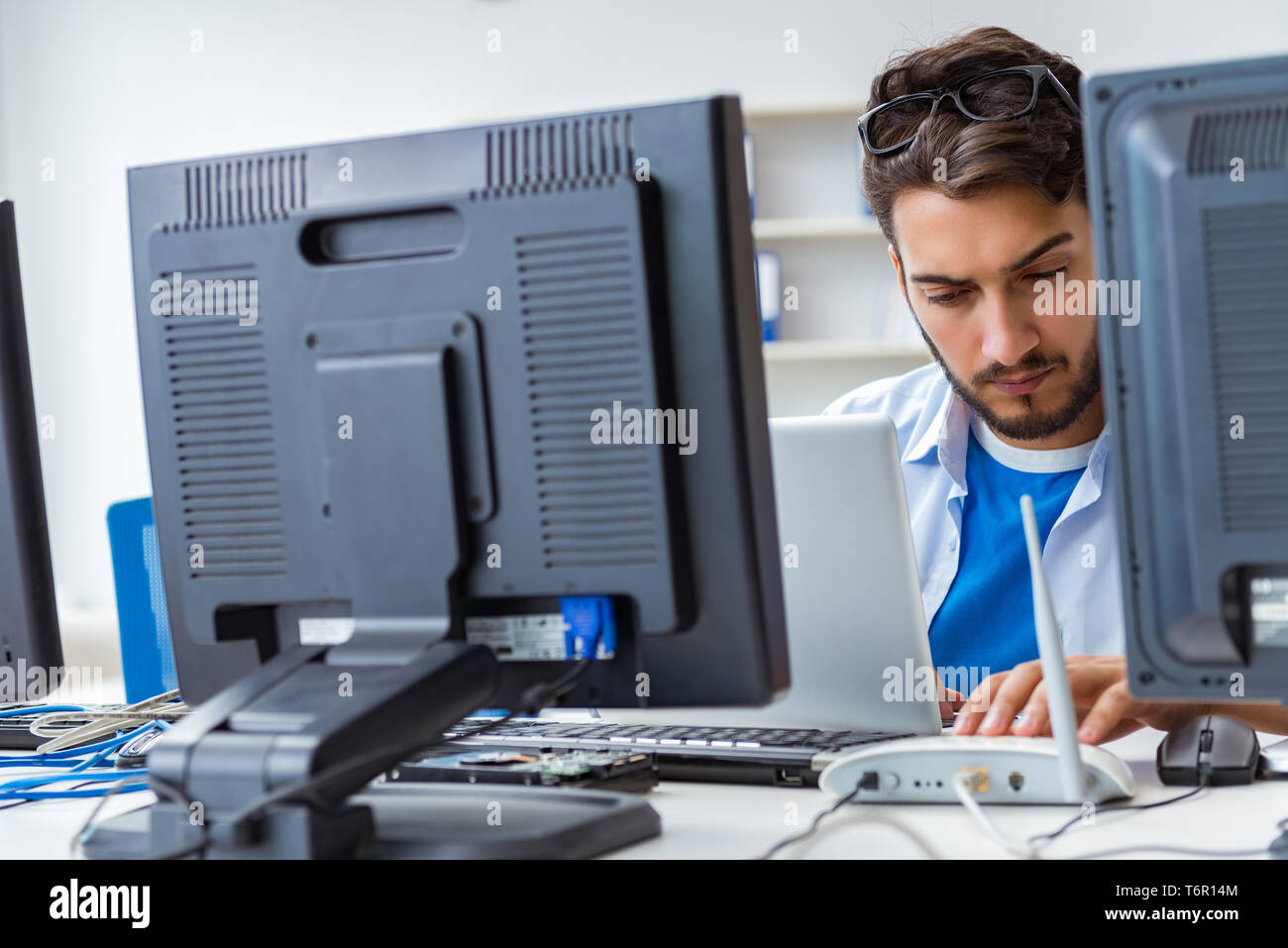 Security man looking at monitors hi-res stock photography and images ...