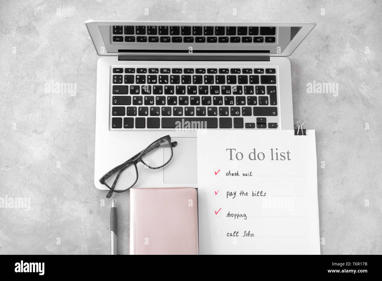 To-do list with laptop on grey background Stock Photo - Alamy