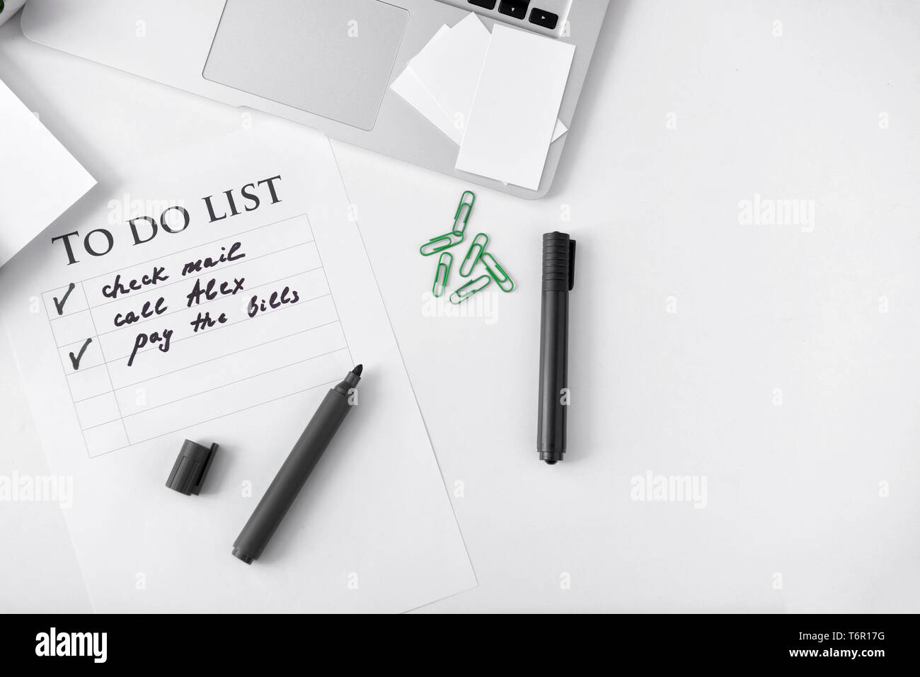 Composition with to-do list on white background Stock Photo - Alamy