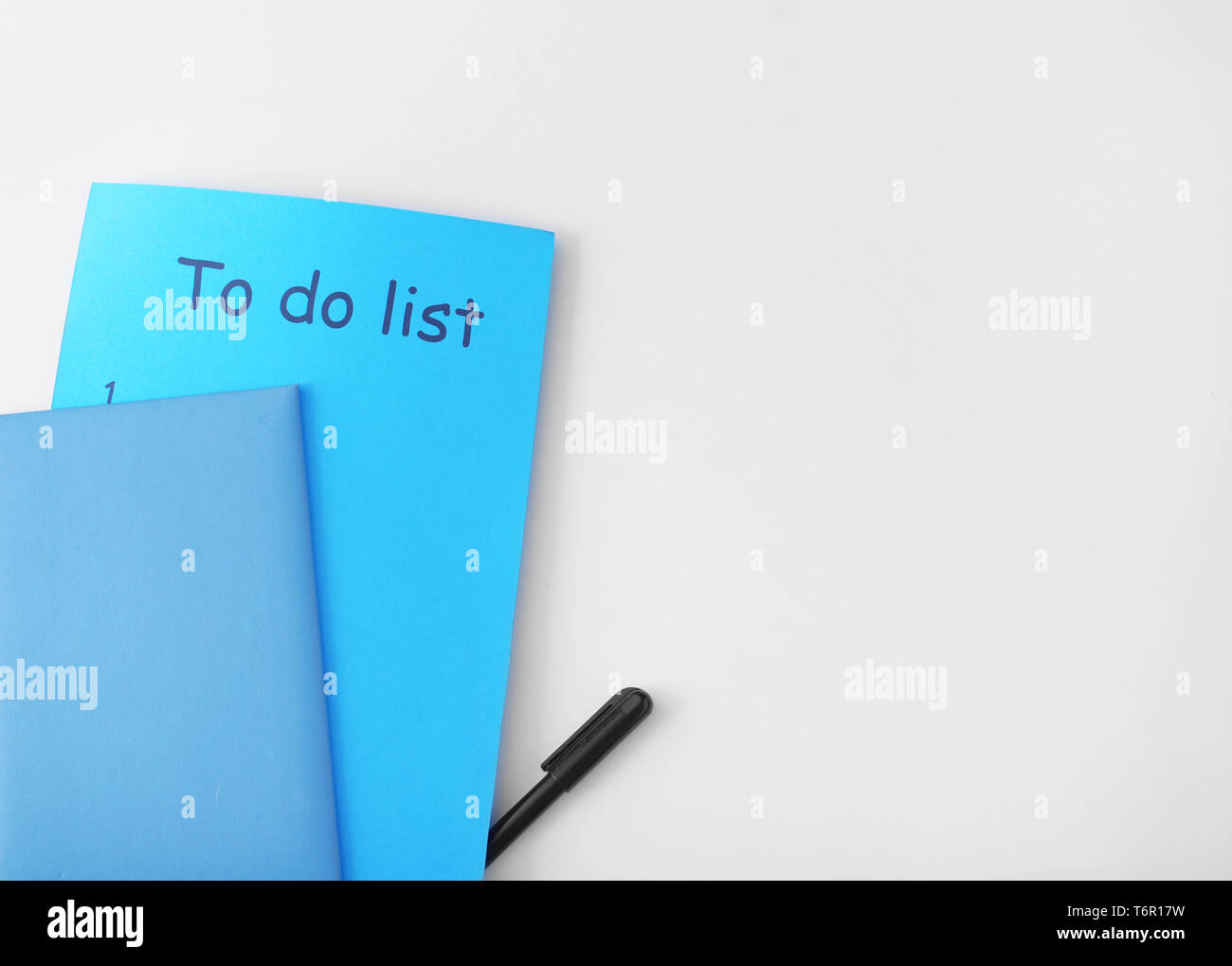 Empty to-do list with notebook on white background Stock Photo - Alamy