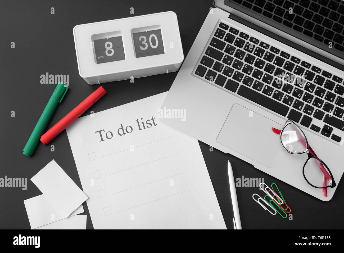 Composition with empty to-do list on dark table Stock Photo - Alamy