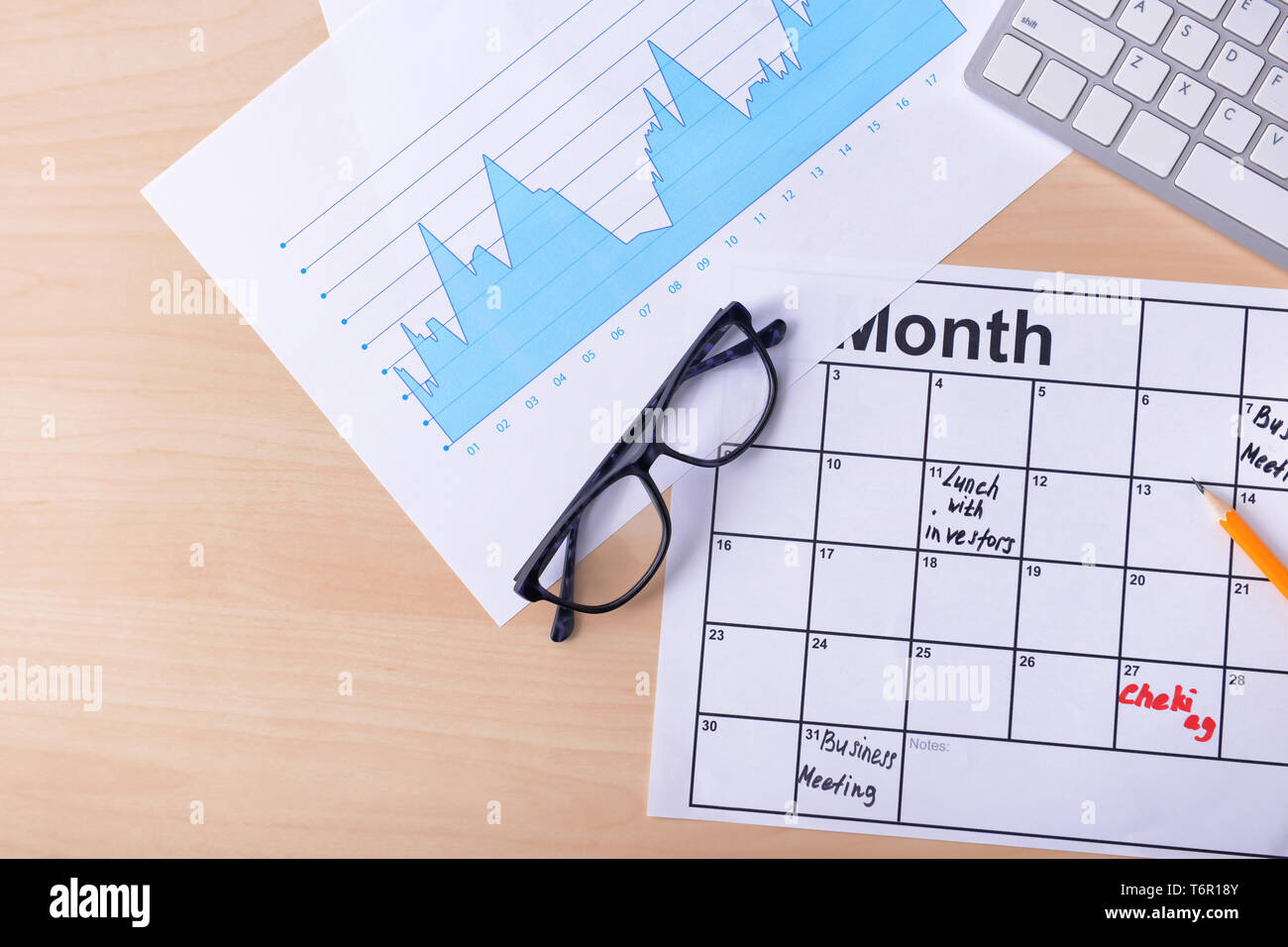 Calendar with to-do list and computer keyboard on wooden background ...