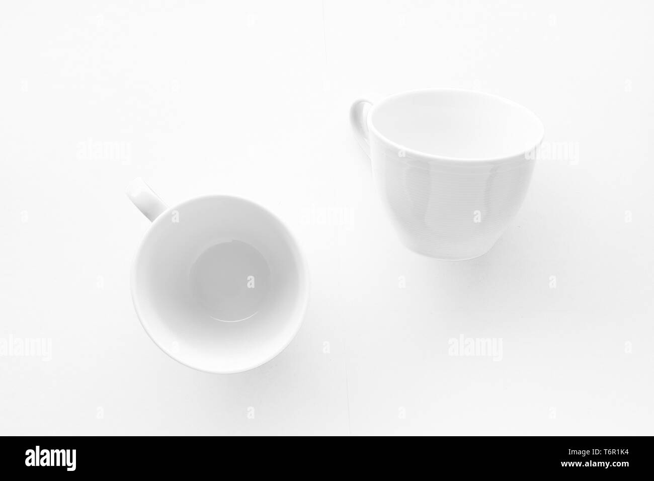 Kitchen, dishware design and drink concept - Empty cup and saucer ...