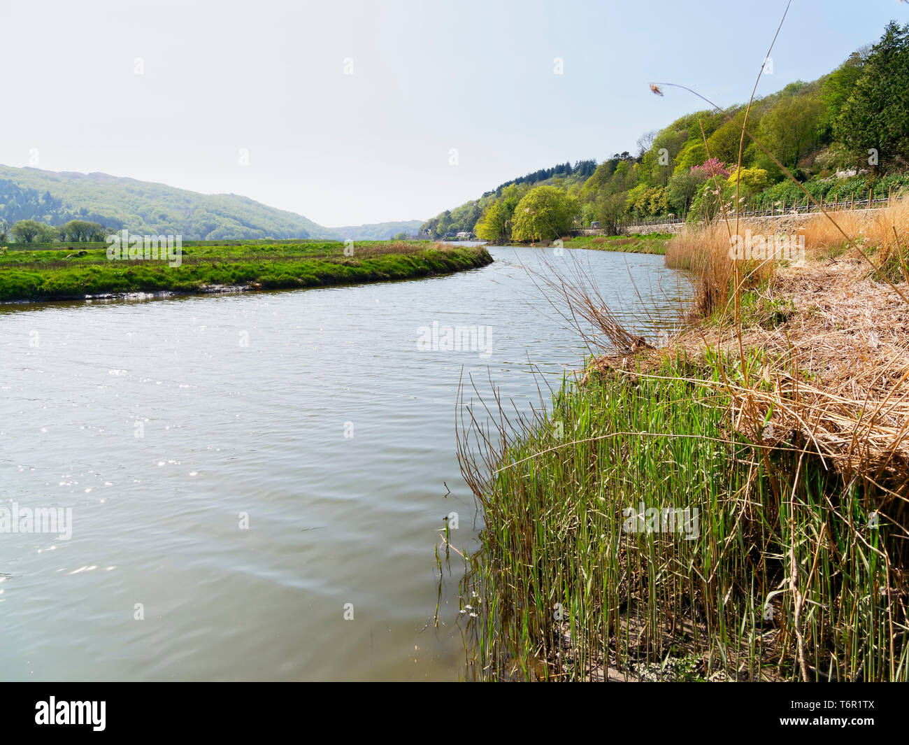 The wind rippled waters of the River Dwyryd winds across meadows on ...