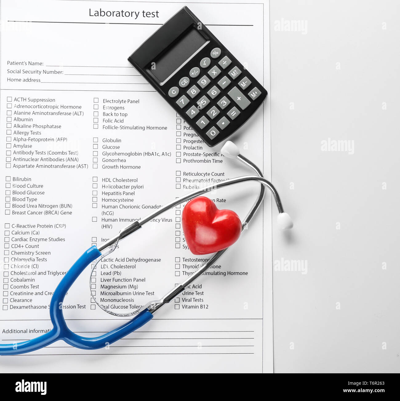 Stethoscope with laboratory test and calculator on white background ...