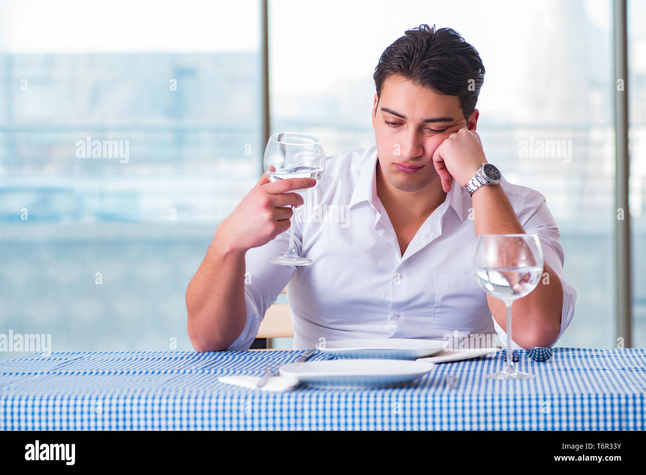 Sad man dining alone hi-res stock photography and images - Alamy