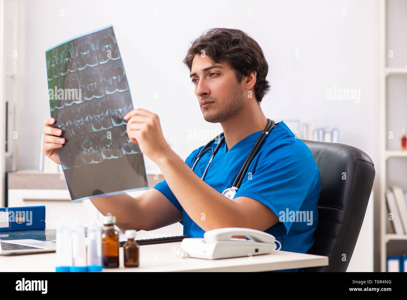 Male doctor radiologist with x-ray can image Stock Photo - Alamy