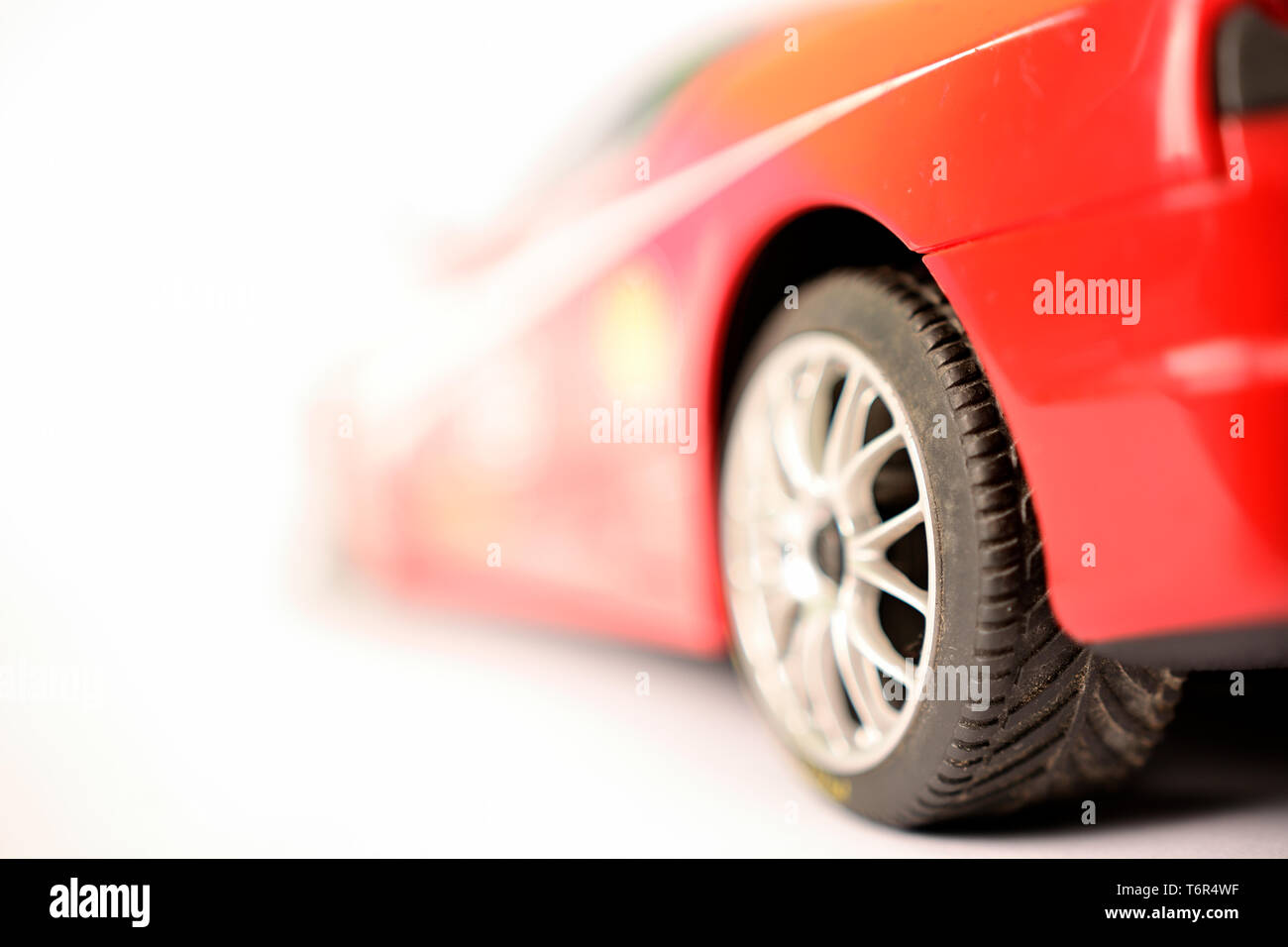 Red sports car model rear view on white background Stock Photo - Alamy