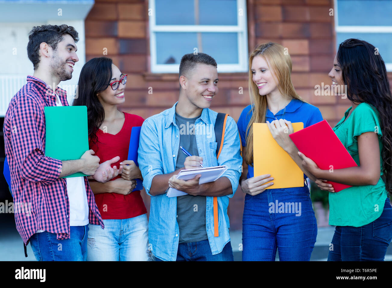 Group of learning students at campus of university Stock Photo - Alamy