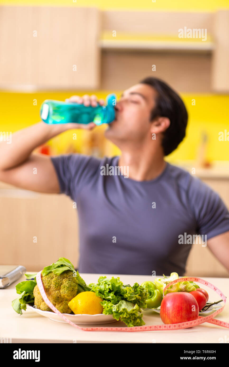 Young man in dieting and healthy eating concept Stock Photo - Alamy