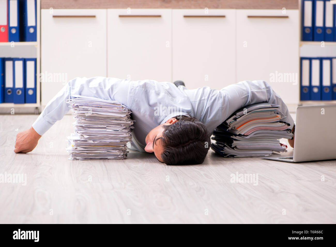 Extremely busy employee working in the office Stock Photo - Alamy