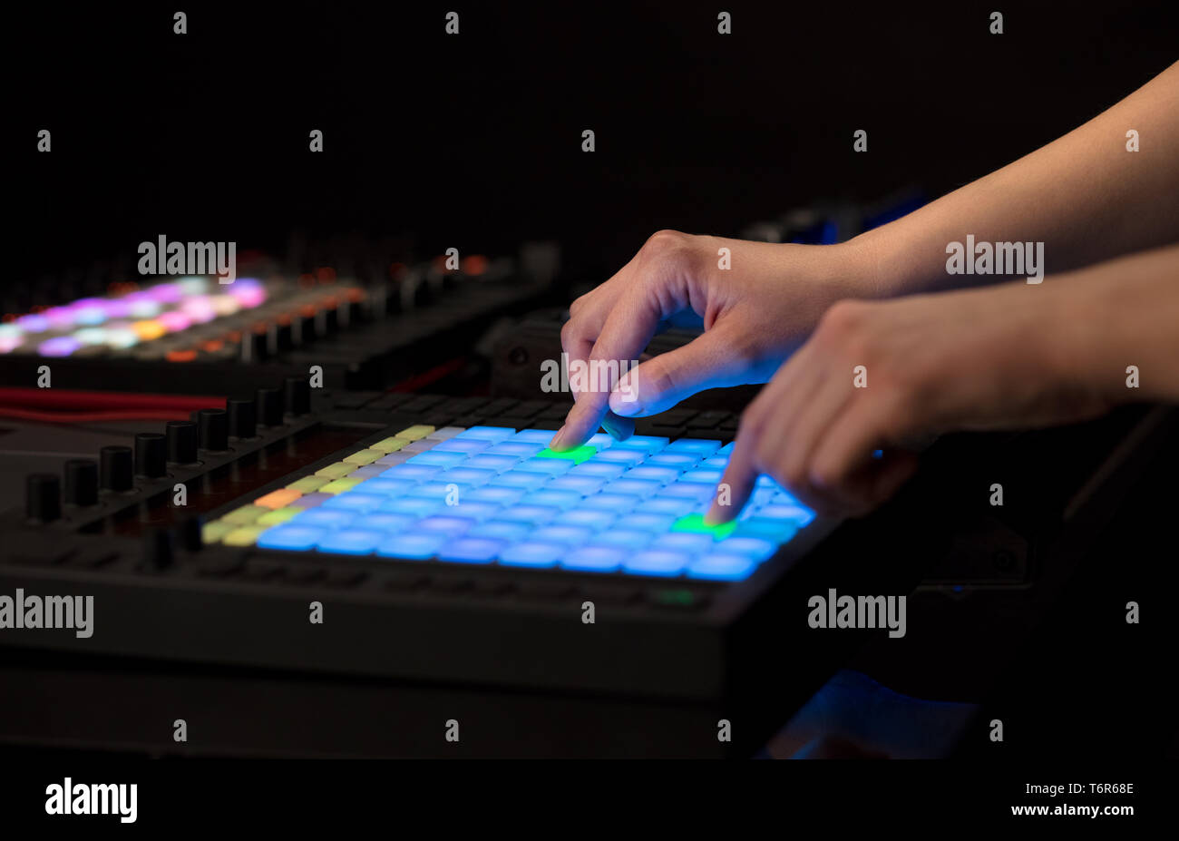 Dj hand remixing music on midi controller Stock Photo - Alamy