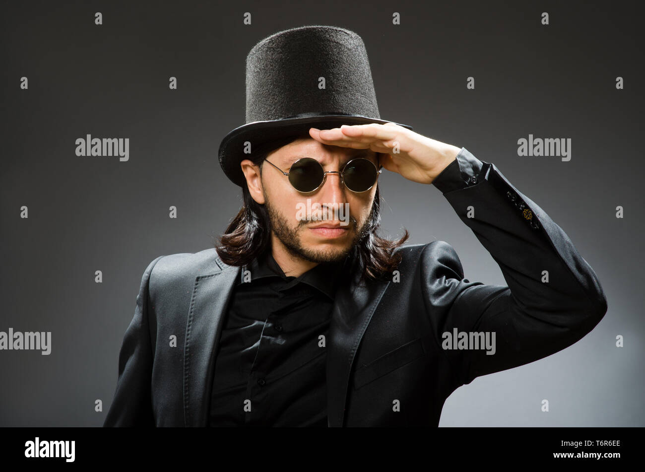 Vintage concept with man wearing black top hat Stock Photo - Alamy