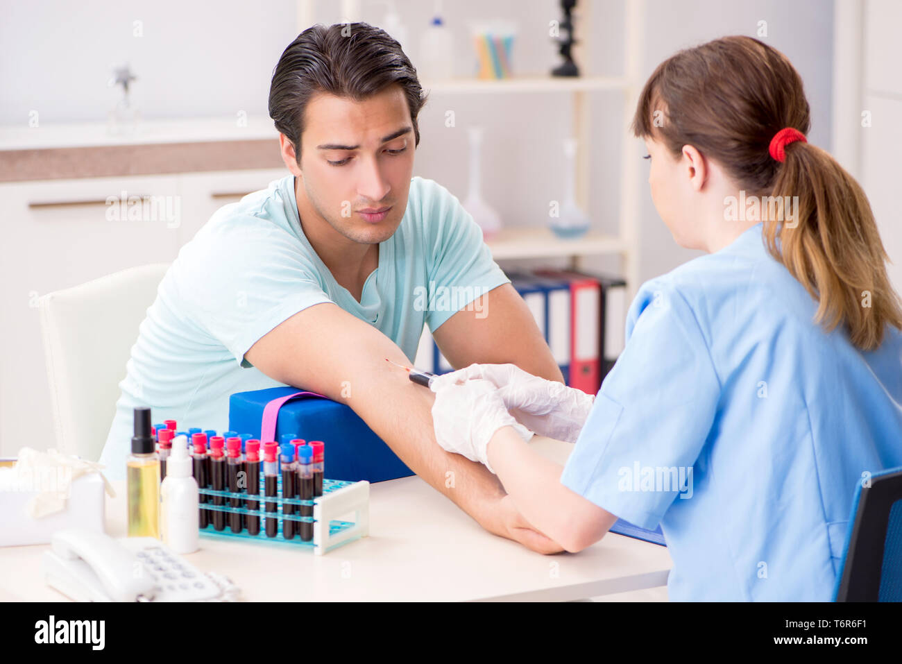Young patient during blood test sampling procedure Stock Photo - Alamy