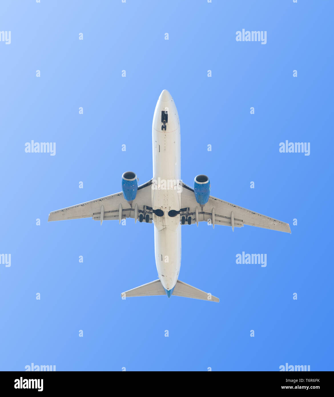 commercial airplane image from bottom on a sunny day Stock Photo - Alamy