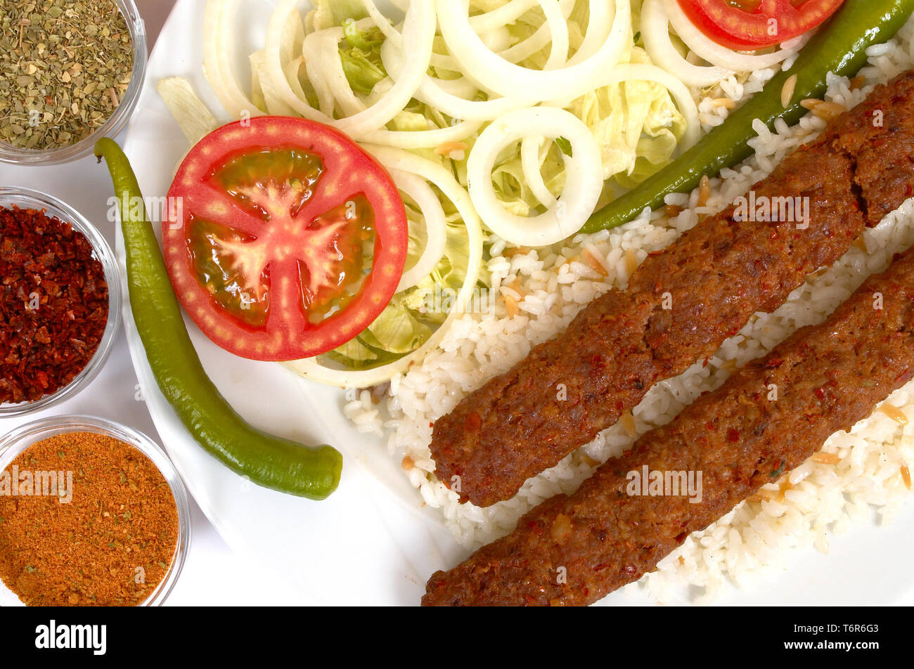 Adana kebap with rice and salads, turkish traditional food series Stock ...