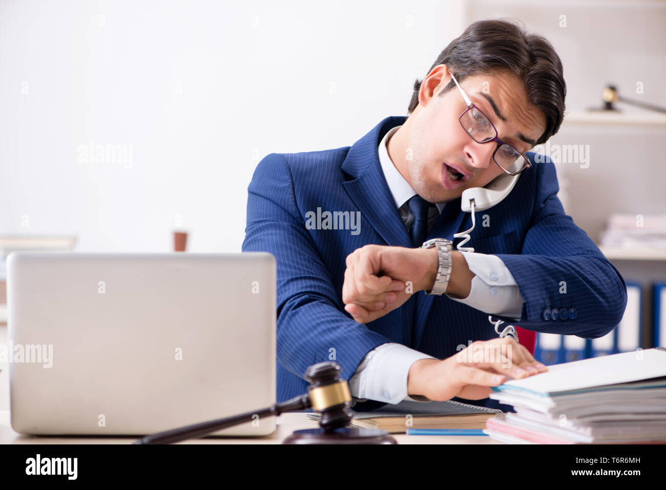 Young handsome judge working in court Stock Photo - Alamy