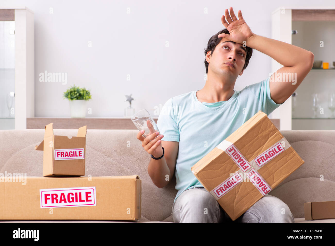 Man opening box disappointed hi-res stock photography and images - Alamy