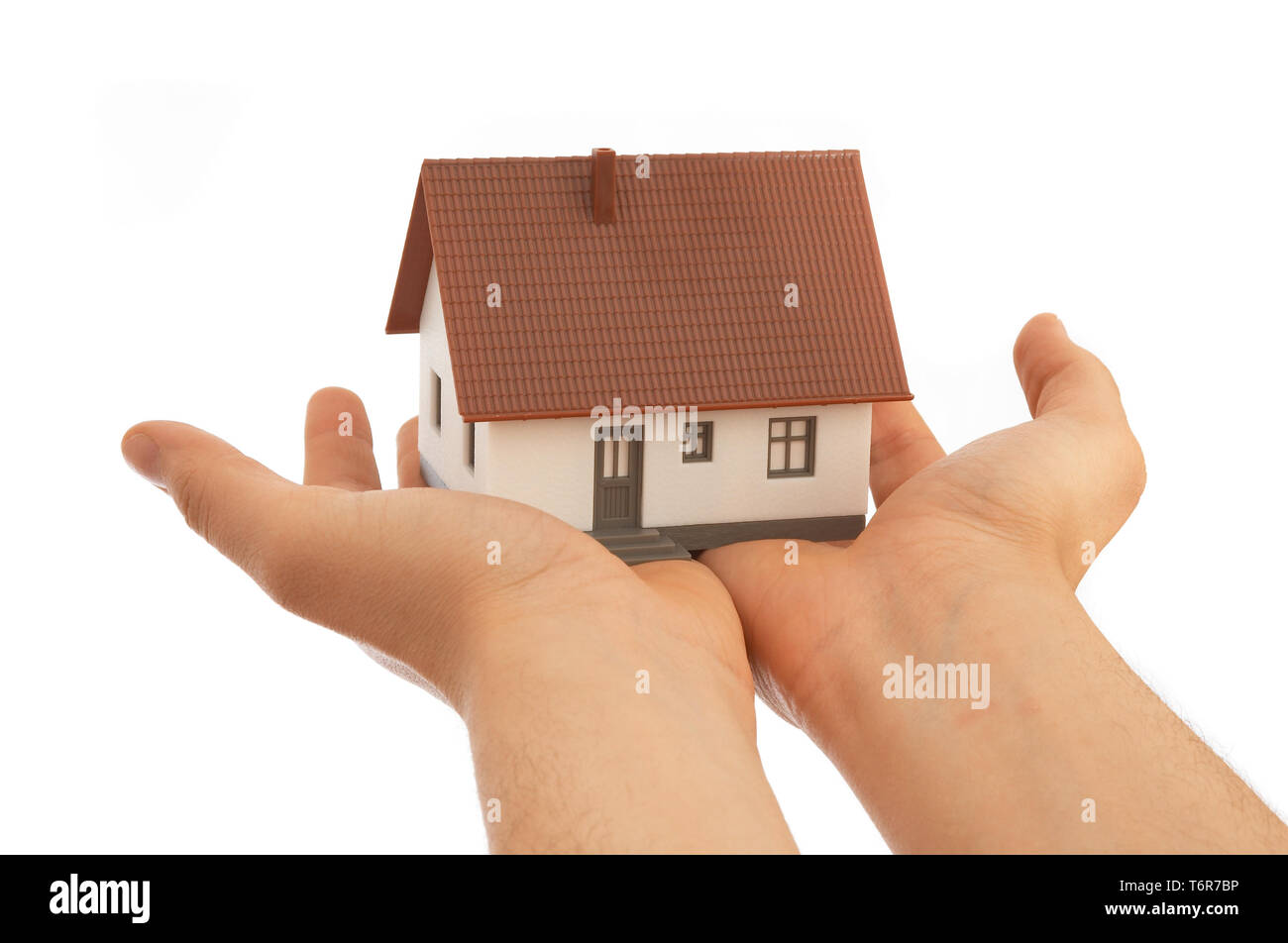 mini house on hands, white background Stock Photo - Alamy