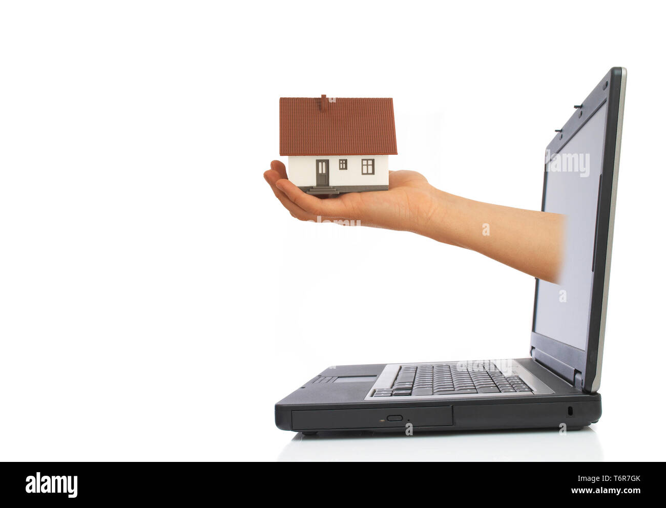 hand giving a mini house from laptop screen with space for messages ...