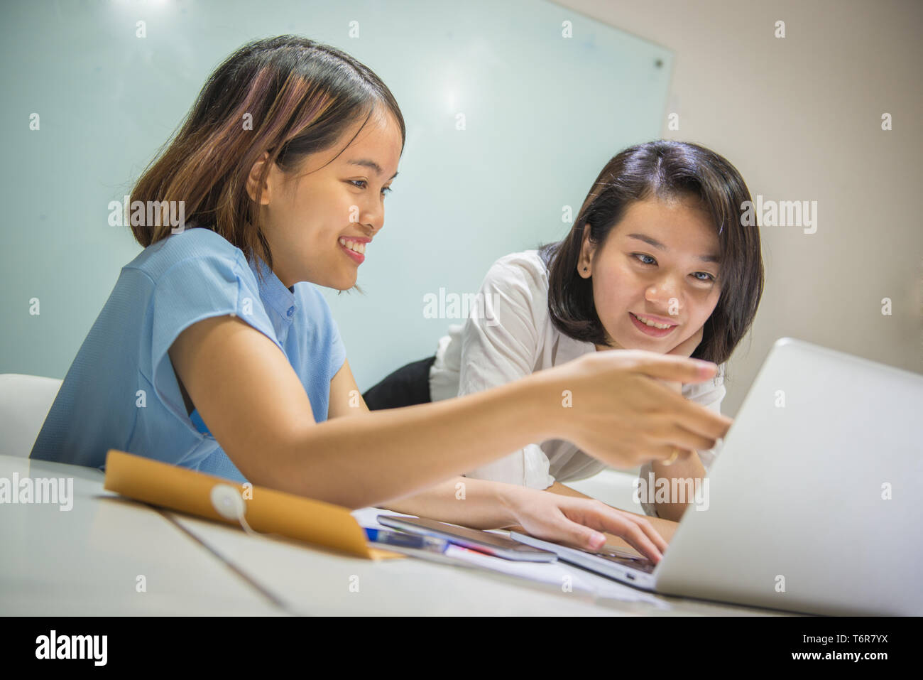 Business team sharing ideas and discussing to each other Stock Photo ...