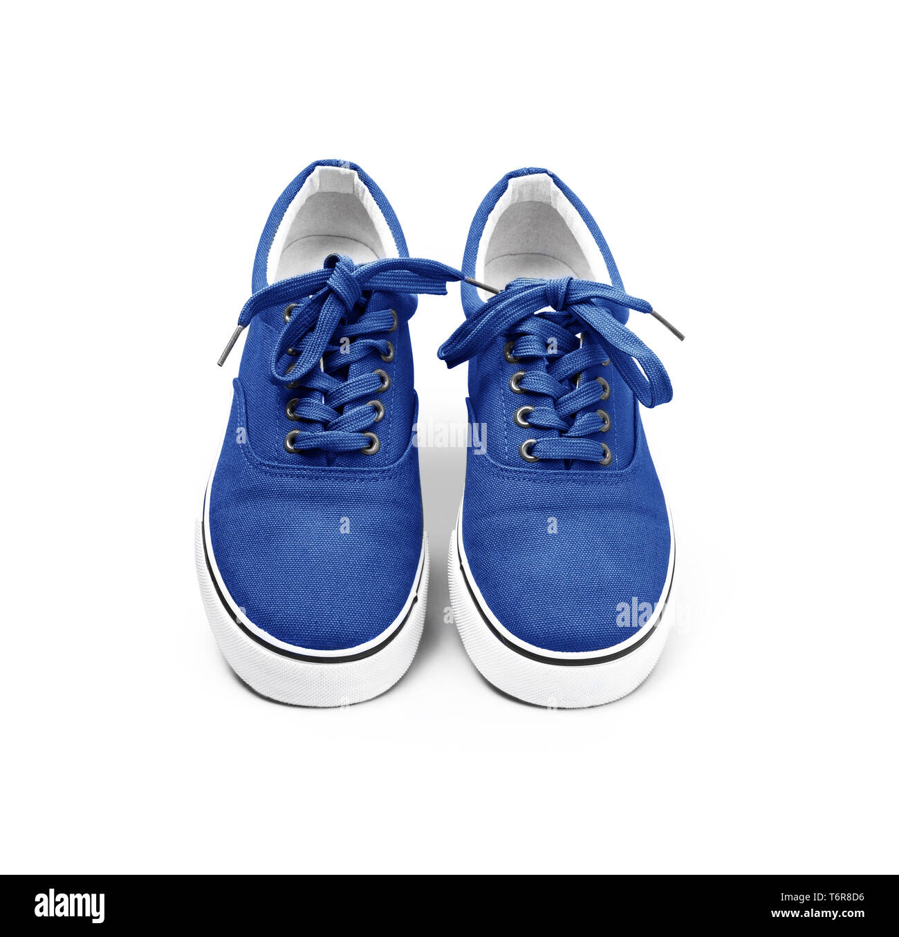 A pair of blue color canvas shoes isolated on white background with ...