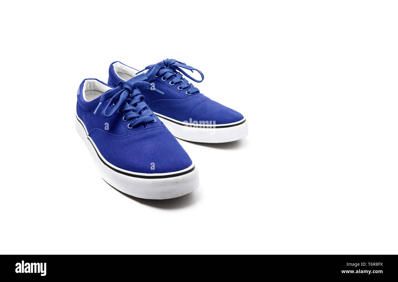 A pair of Blue canvas shoes isolated on white background with clipping ...