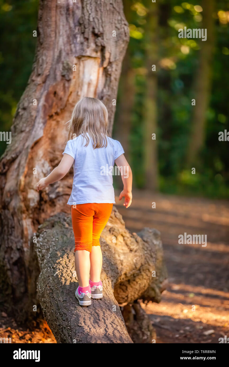 Young Girl Balancing Tree Trunk High Resolution Stock Photography and ...