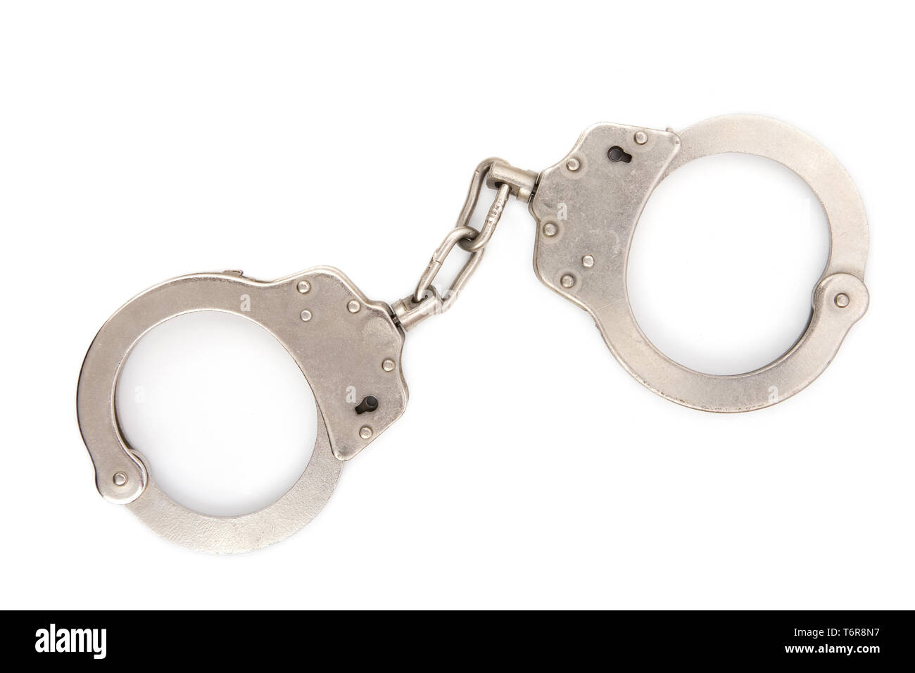 handcuff close up on white background Stock Photo - Alamy