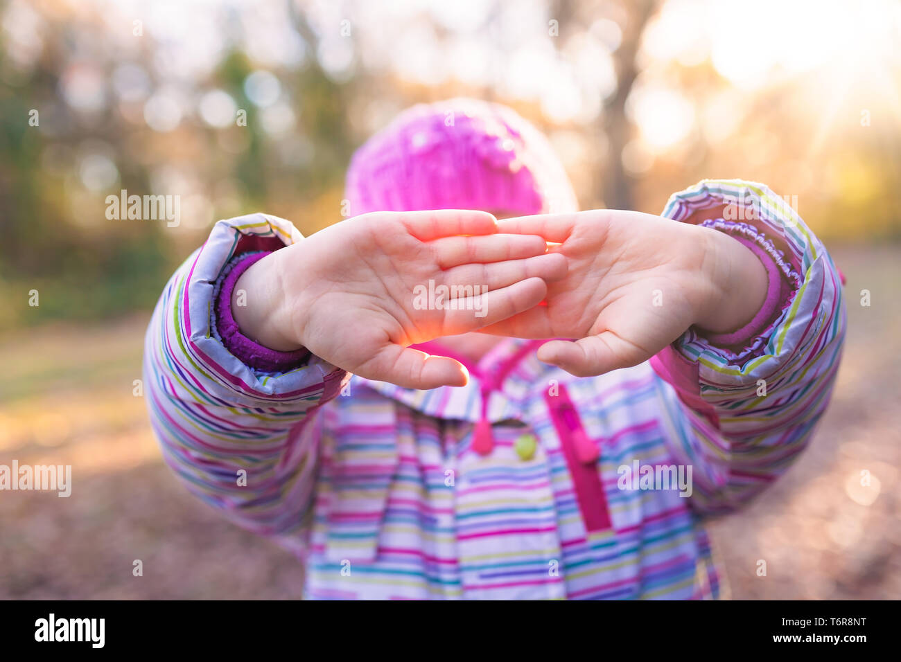 Girl making hand gesture Stock Photo - Alamy