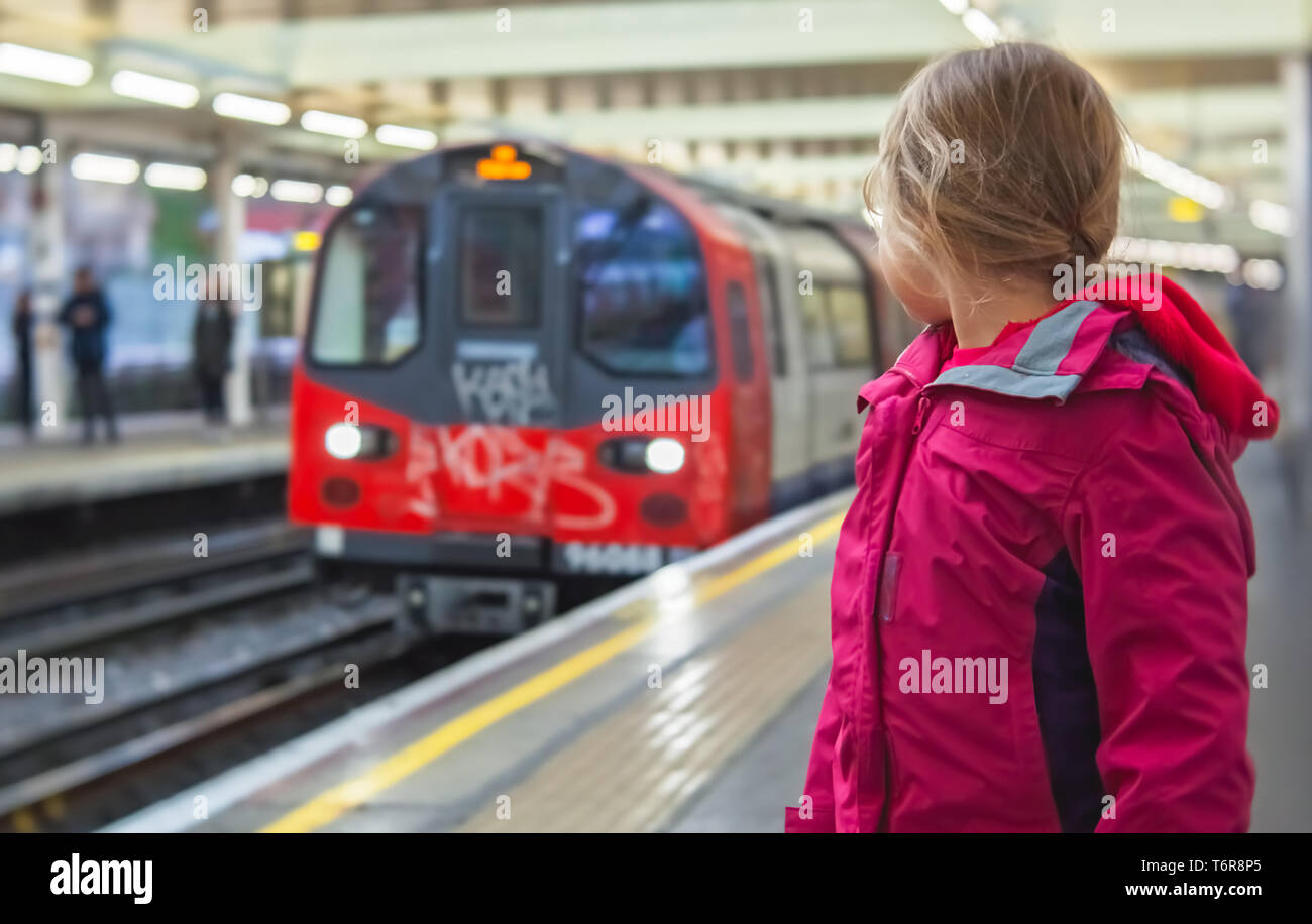 Girl waiting for a train Stock Photo - Alamy