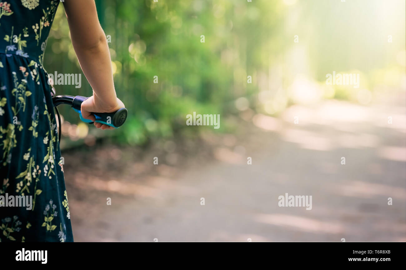 Girl riding bicycle in the park Stock Photo - Alamy
