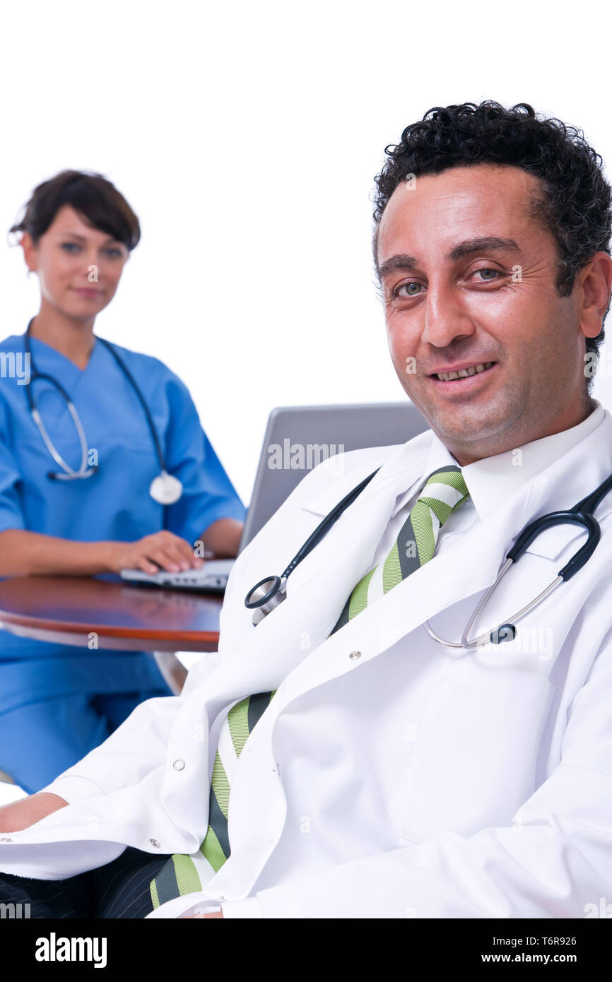 Nurse assisting doctor in hospital Stock Photo - Alamy