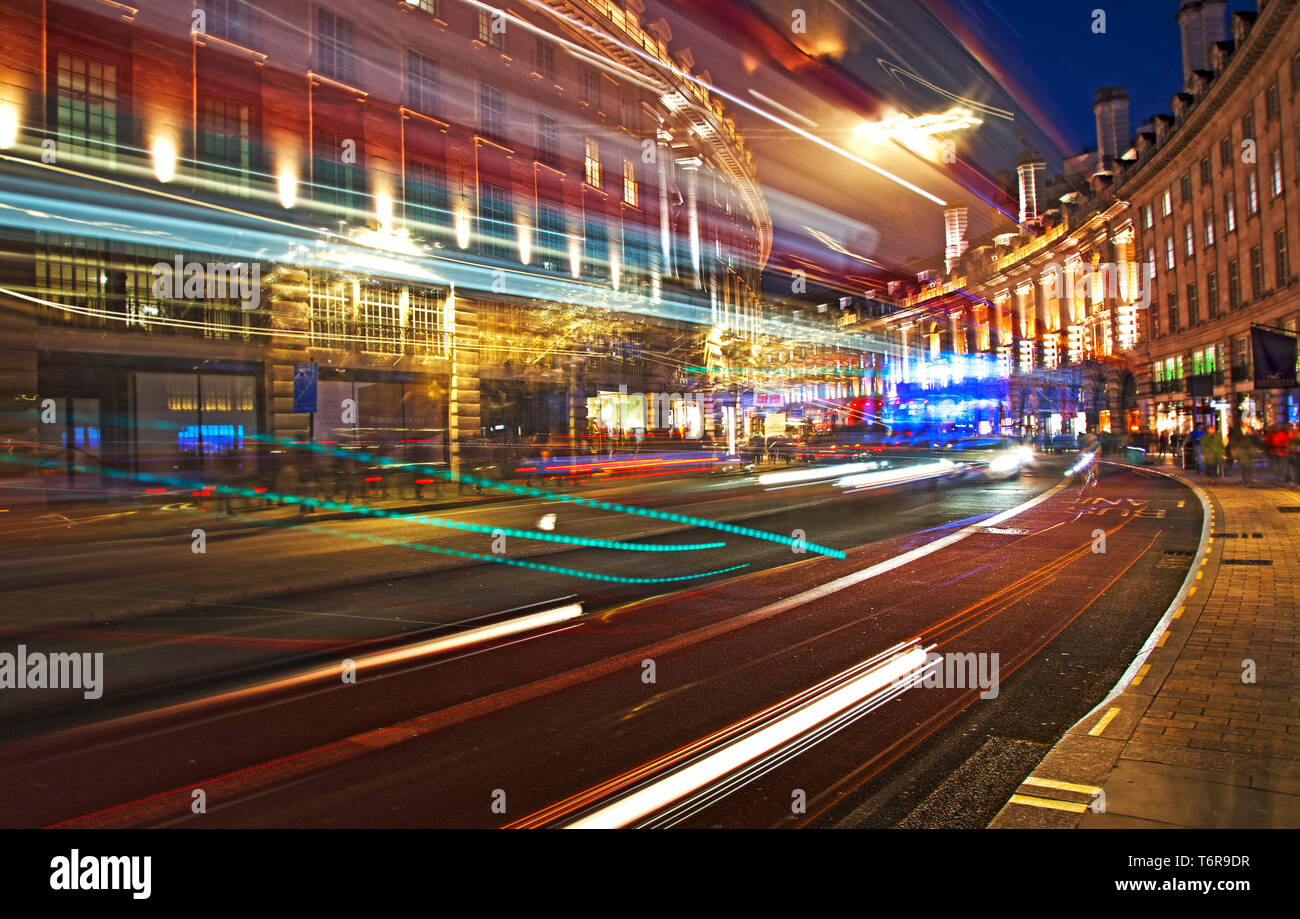night scene of London city - long exposure photography with moving bus ...