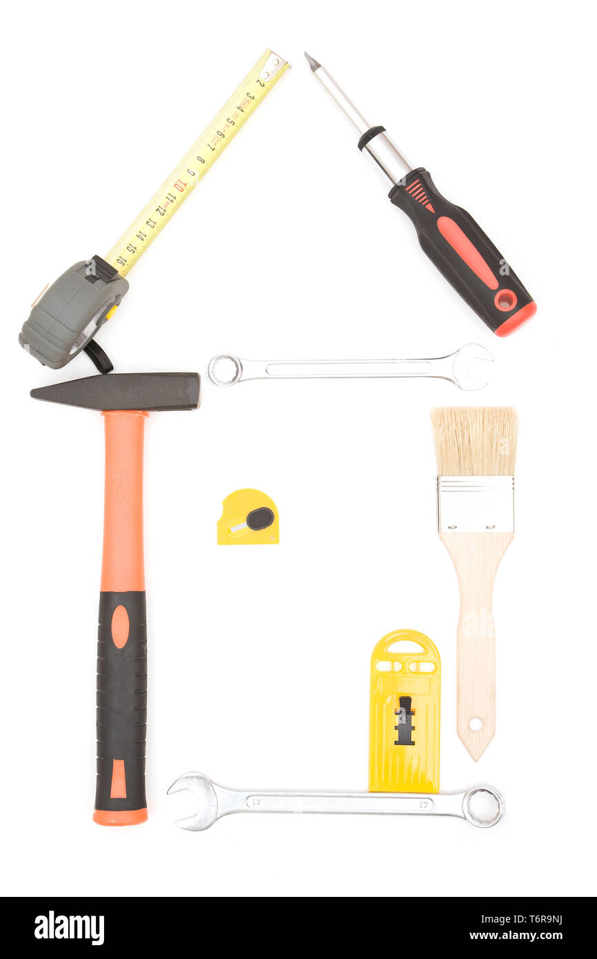 real estate concept with a lot of tools shaping a mini house Stock ...