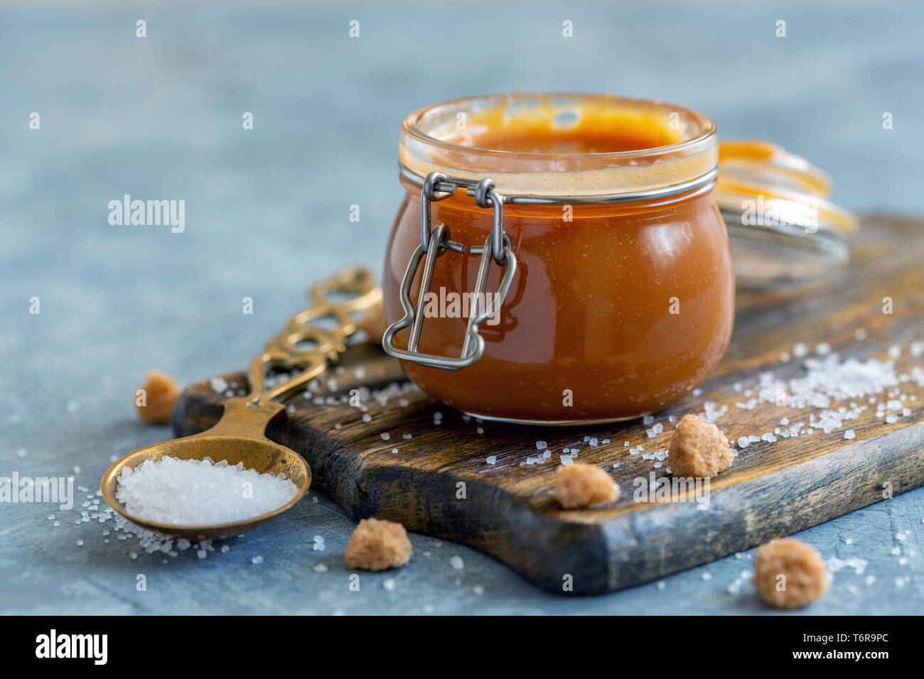 Glass jar with homemade salted caramel Stock Photo - Alamy