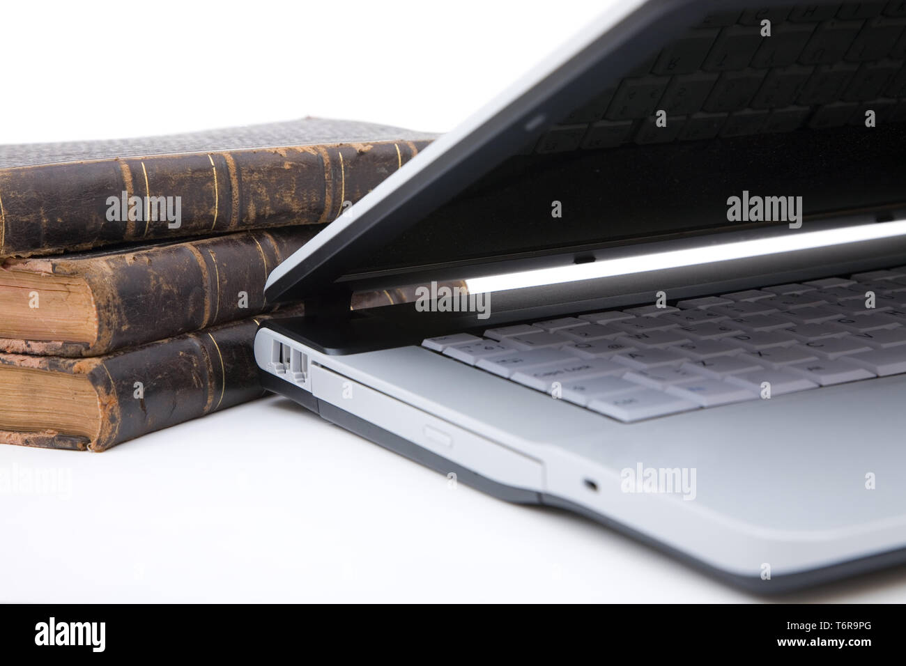 old legal books with modern laptop on white background Stock Photo - Alamy