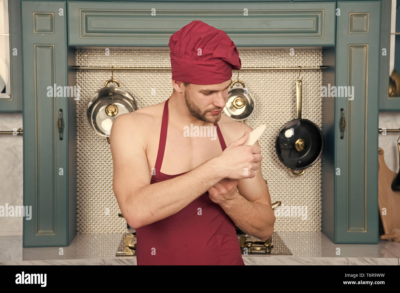 Chef choose professional tools. Kitchen utensils and tools. Chef hold ...