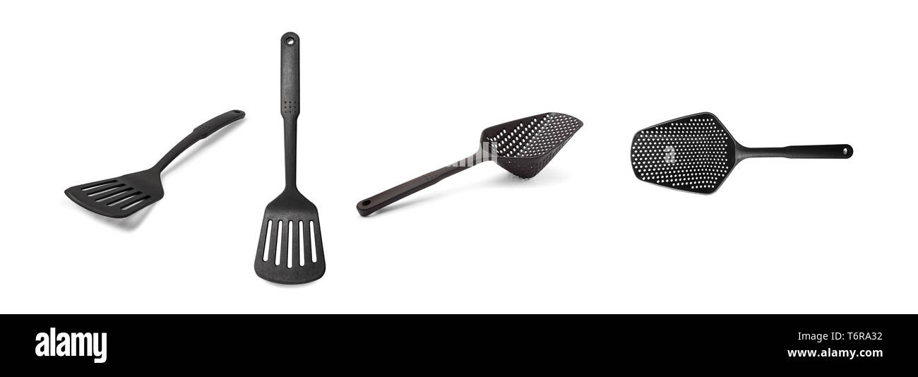 Black Plastic kitchen utensils. Spatula and strainer isolated on a ...