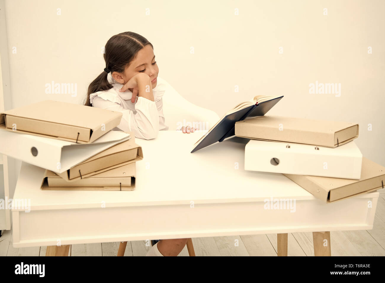 Bored concept. Cute girl got bored with much information. Little child ...