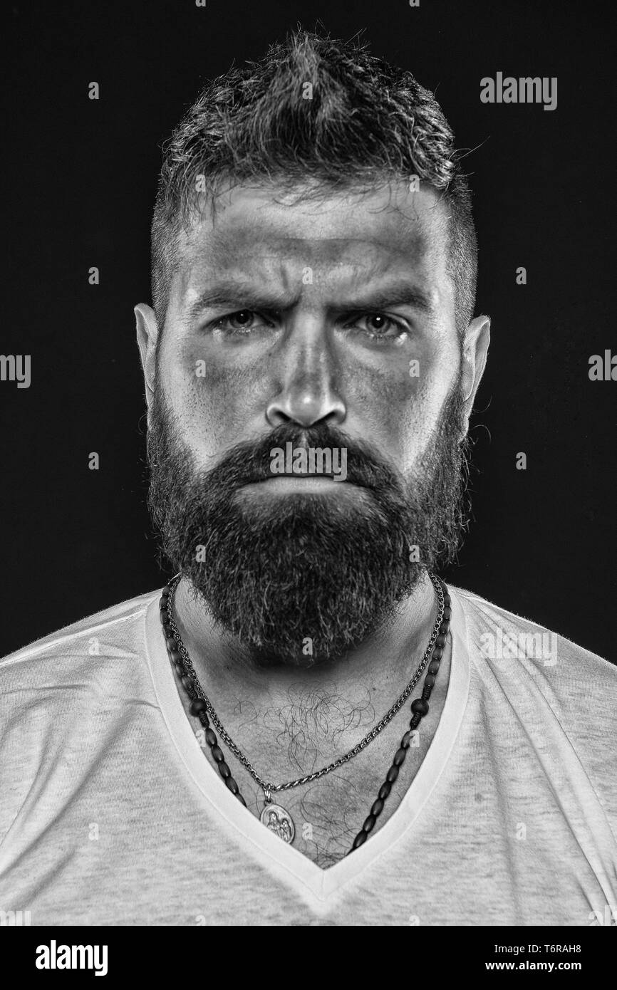 Brutality and masculinity. Man bearded hipster serious face close up ...