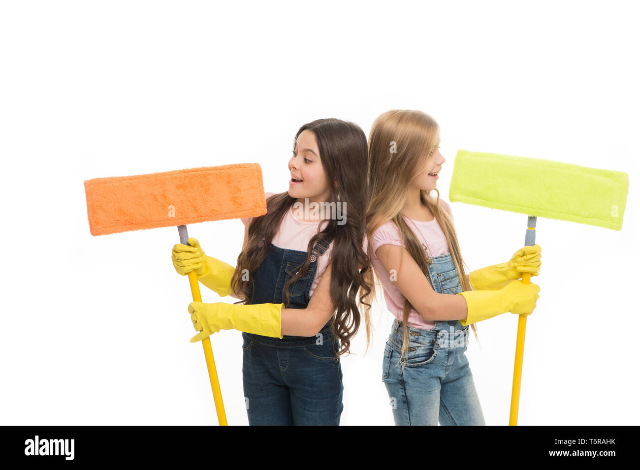 Girls with protective gloves and mops ready for cleaning. Household ...