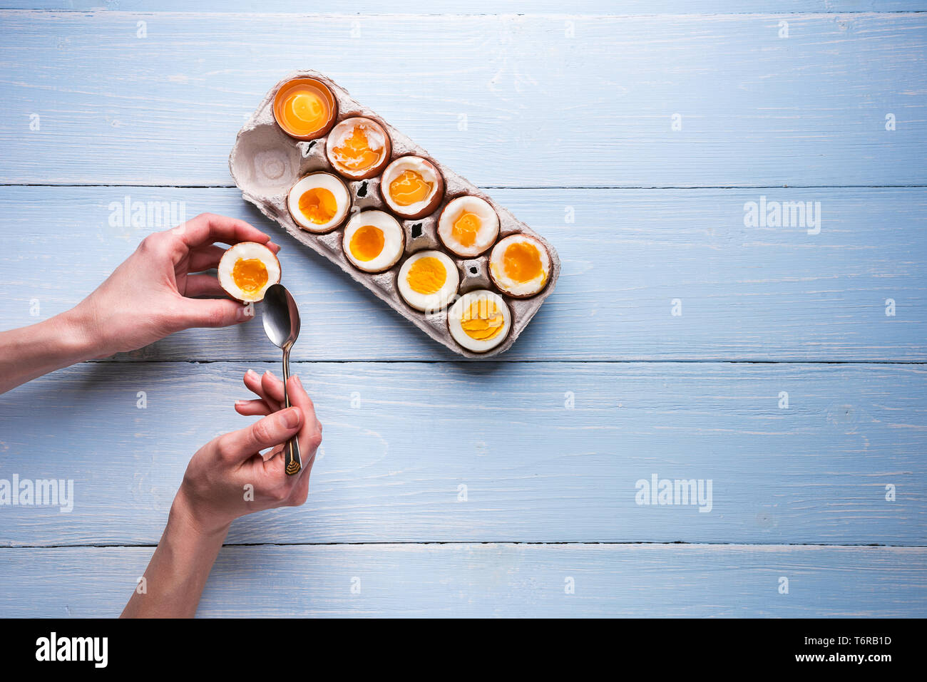 Woman hands peeling boiled egg hi-res stock photography and images - Alamy