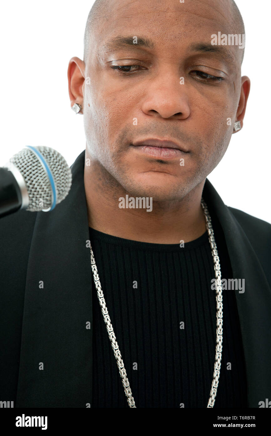African American singer standing on a white background Stock Photo - Alamy