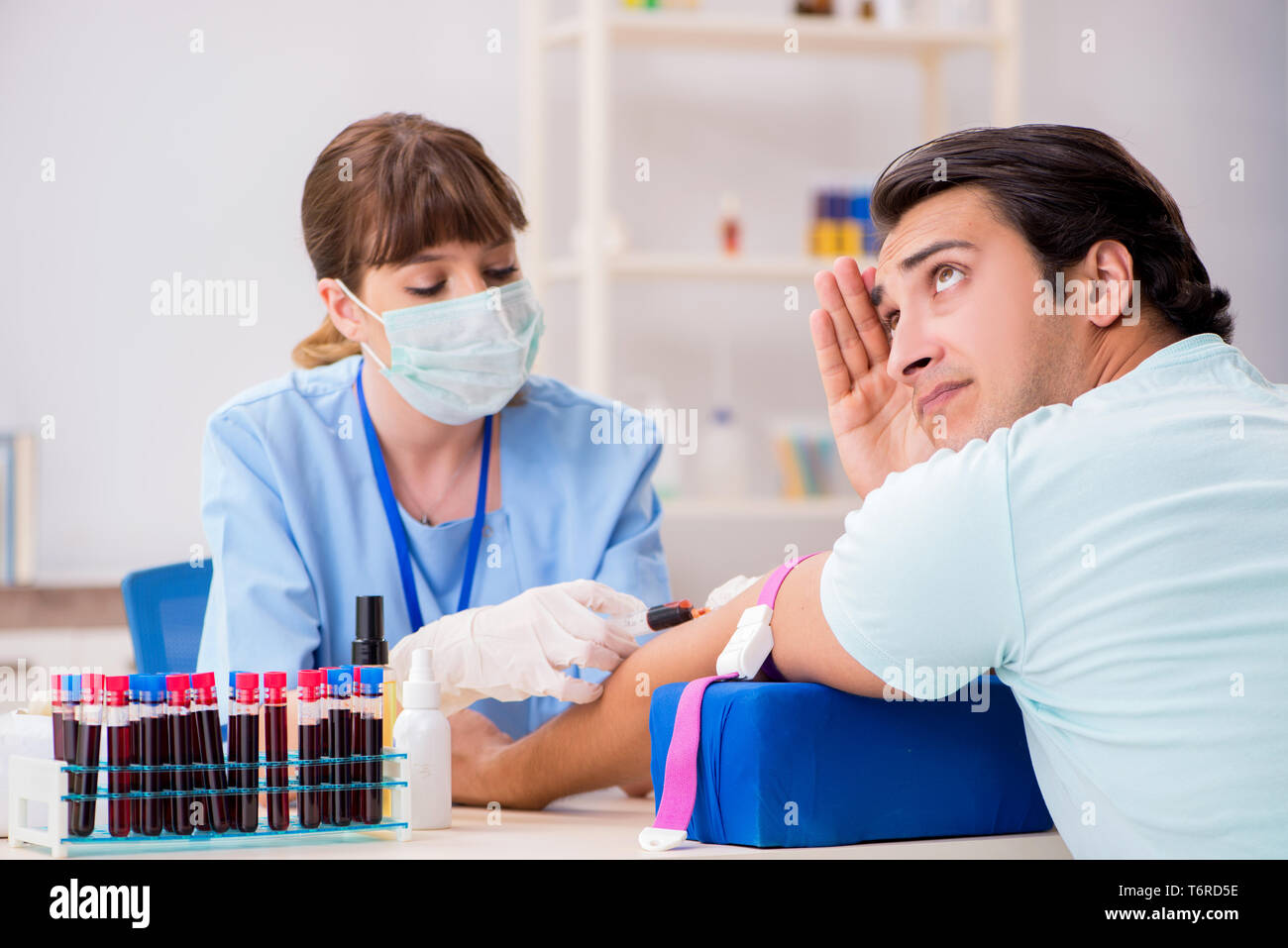 Young patient during blood test sampling procedure Stock Photo - Alamy